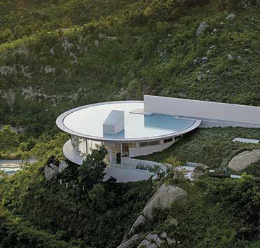 Water Drop Library, circular show perched on a cliff - Harmonies Magazine